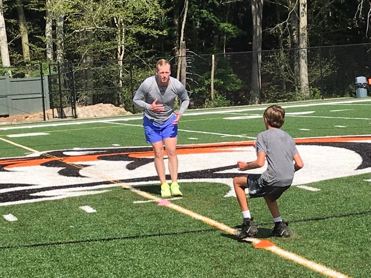 Former NFL quarterbacks Phil, Chris and Matt Simms combined their Simms ...